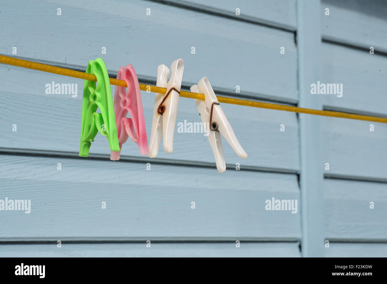 Clothes pegs on a washing line Stock Photo - Alamy