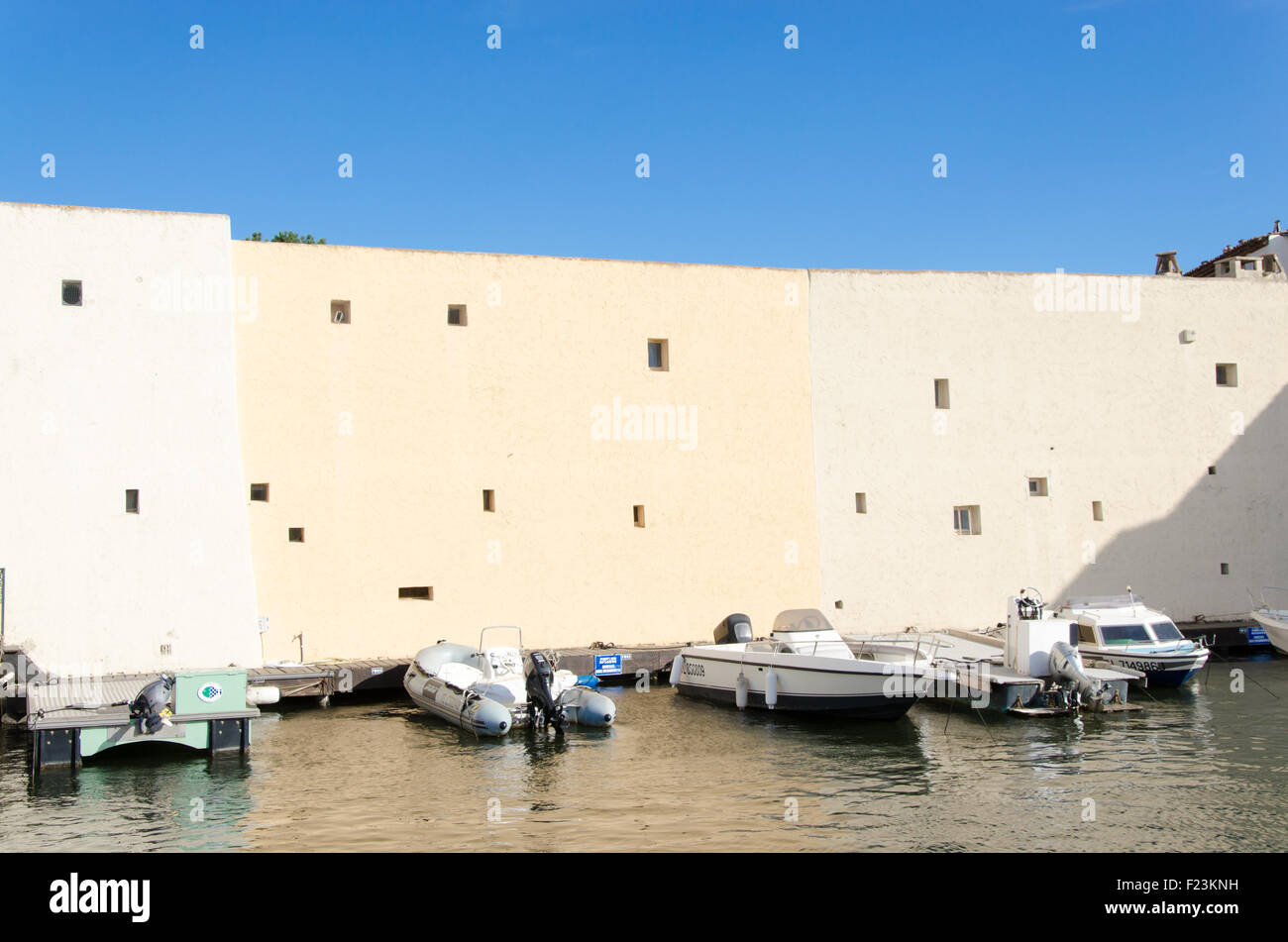 Frontage of buildings architecture beautiful beige building, canal and ...