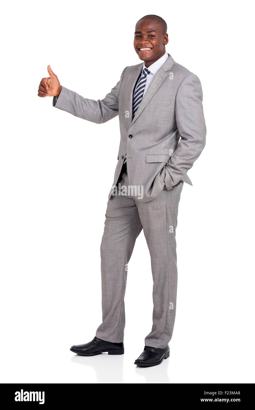 side view of happy young African business executive giving thumb up ...