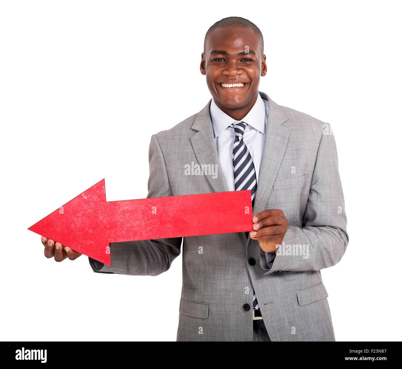 cheerful young African man with direction arrow sign on white ...