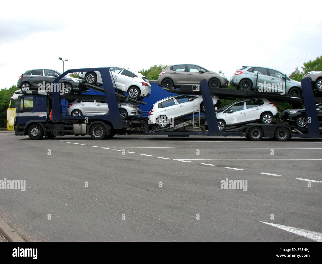 A huge truck transporting cars on a highway in Europe Stock Photo - Alamy