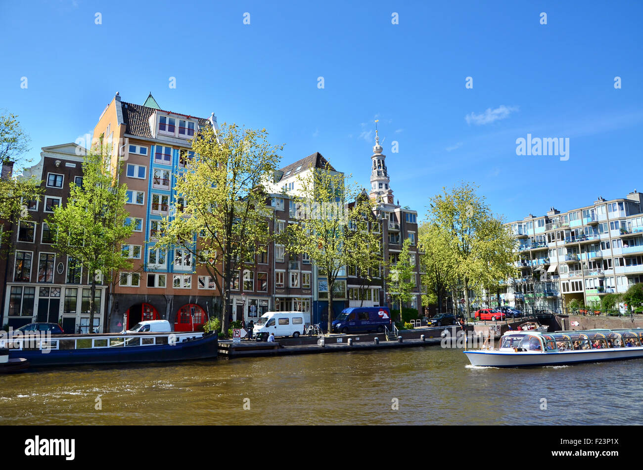 Amsterdam canals and typical houses with clear summer sky, Netherlands ...