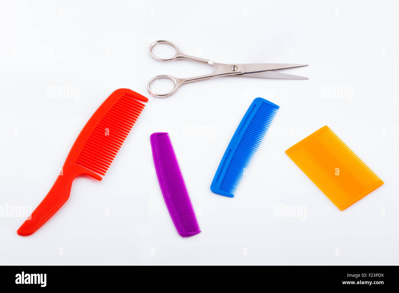scissor and colored combs Stock Photo - Alamy