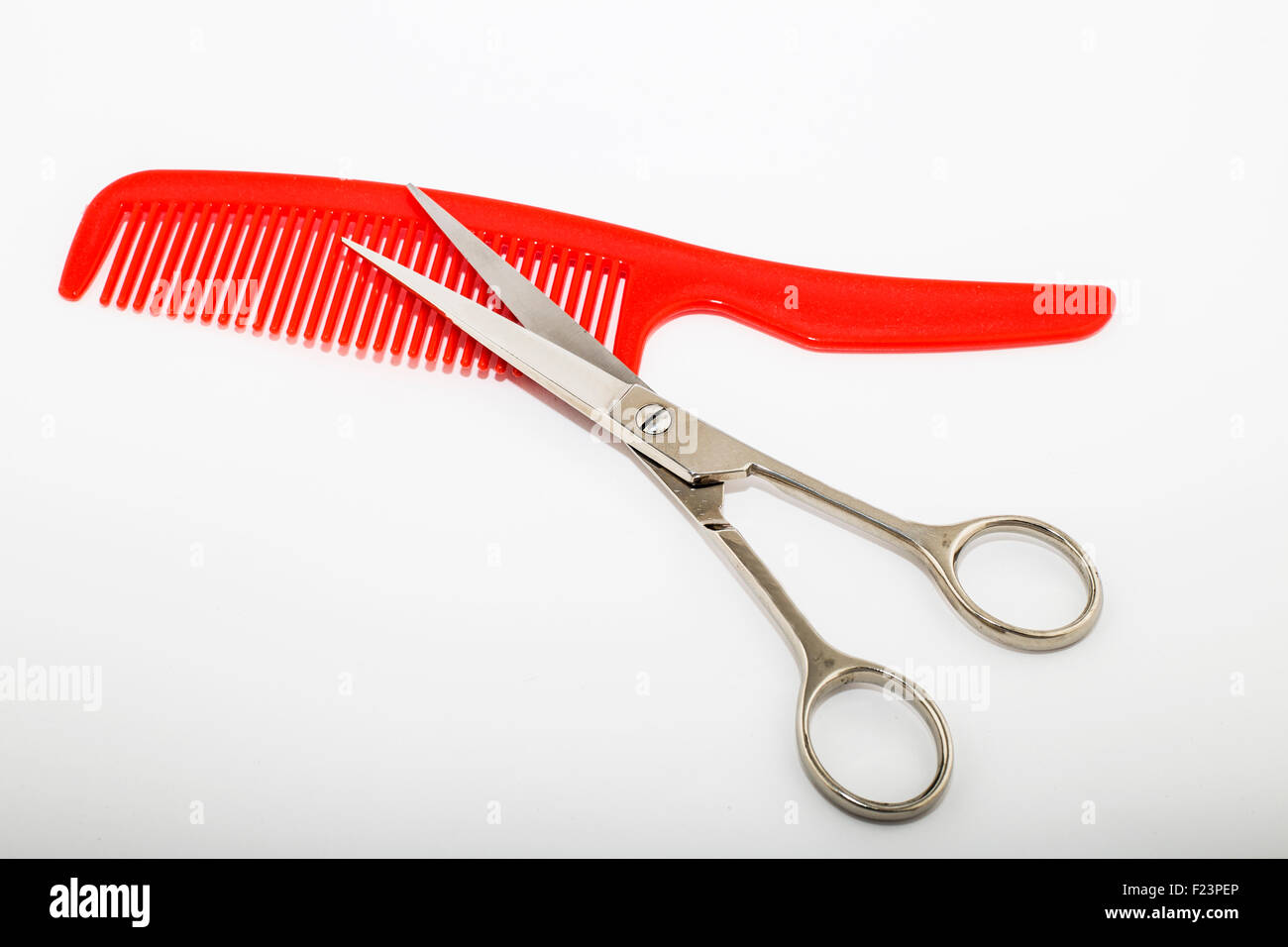 scissor on comb Stock Photo - Alamy