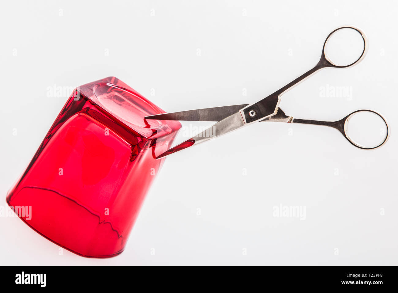 scissors and red glass Stock Photo - Alamy