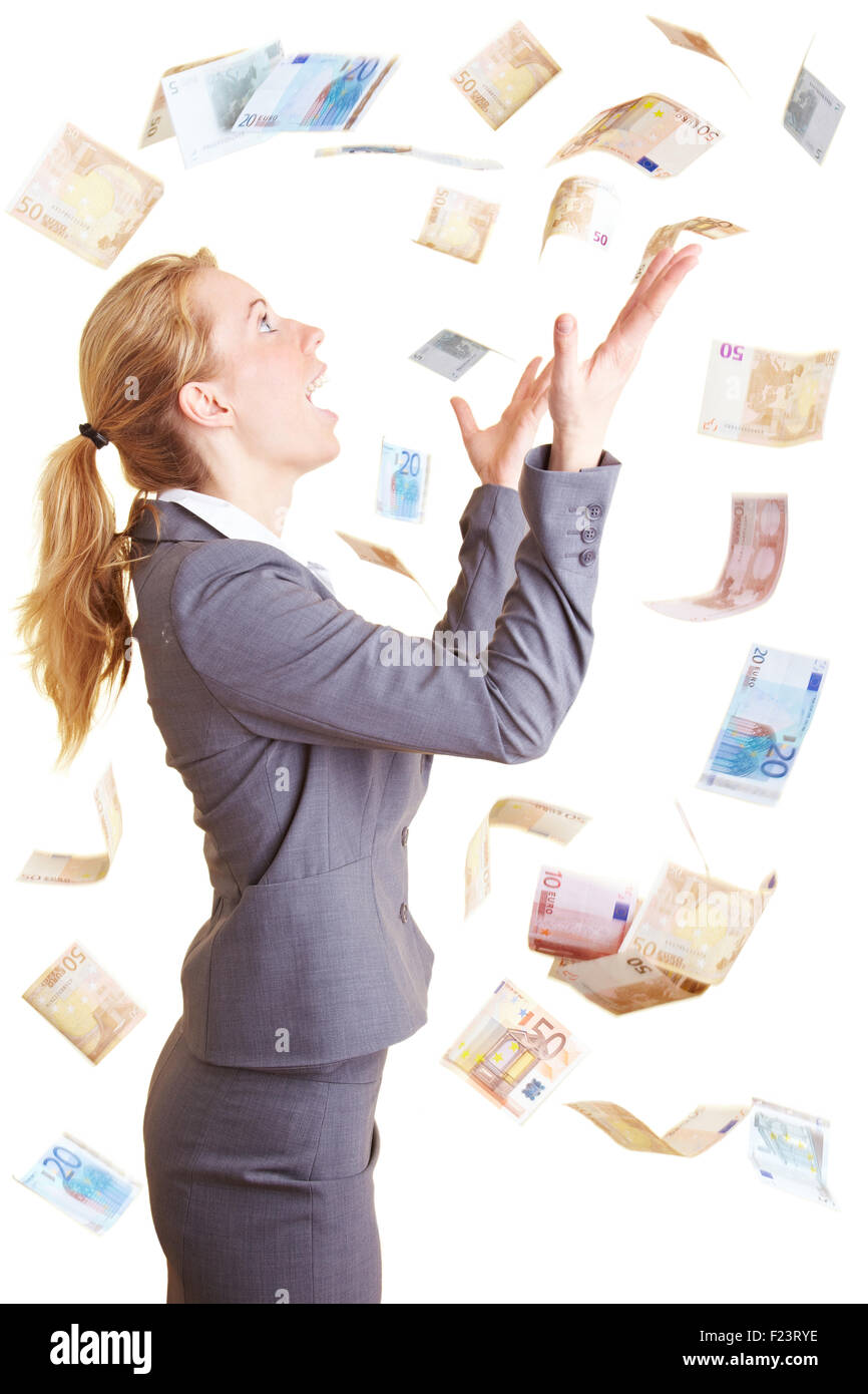 Blonde happy businesswoman catching money raining from the sky Stock ...