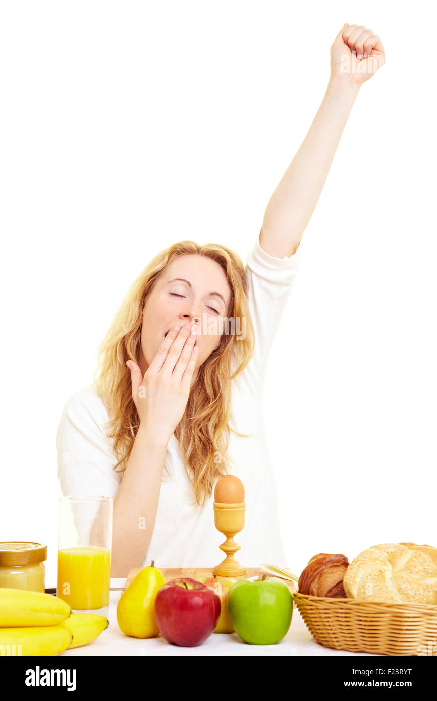 Woman yawning in the morning on the breakfast table Stock Photo - Alamy