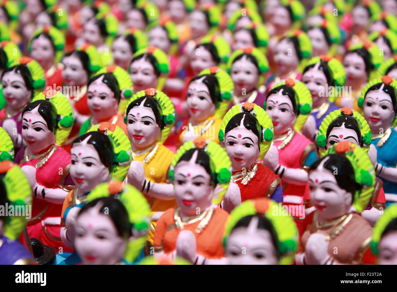A background of colorful idols of hindu goddesses for sale in a shop on ...