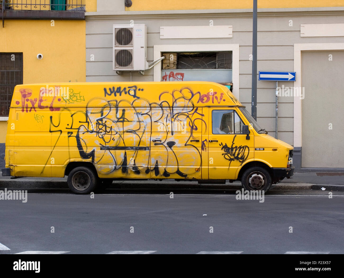Yellow van on the road Stock Photo - Alamy