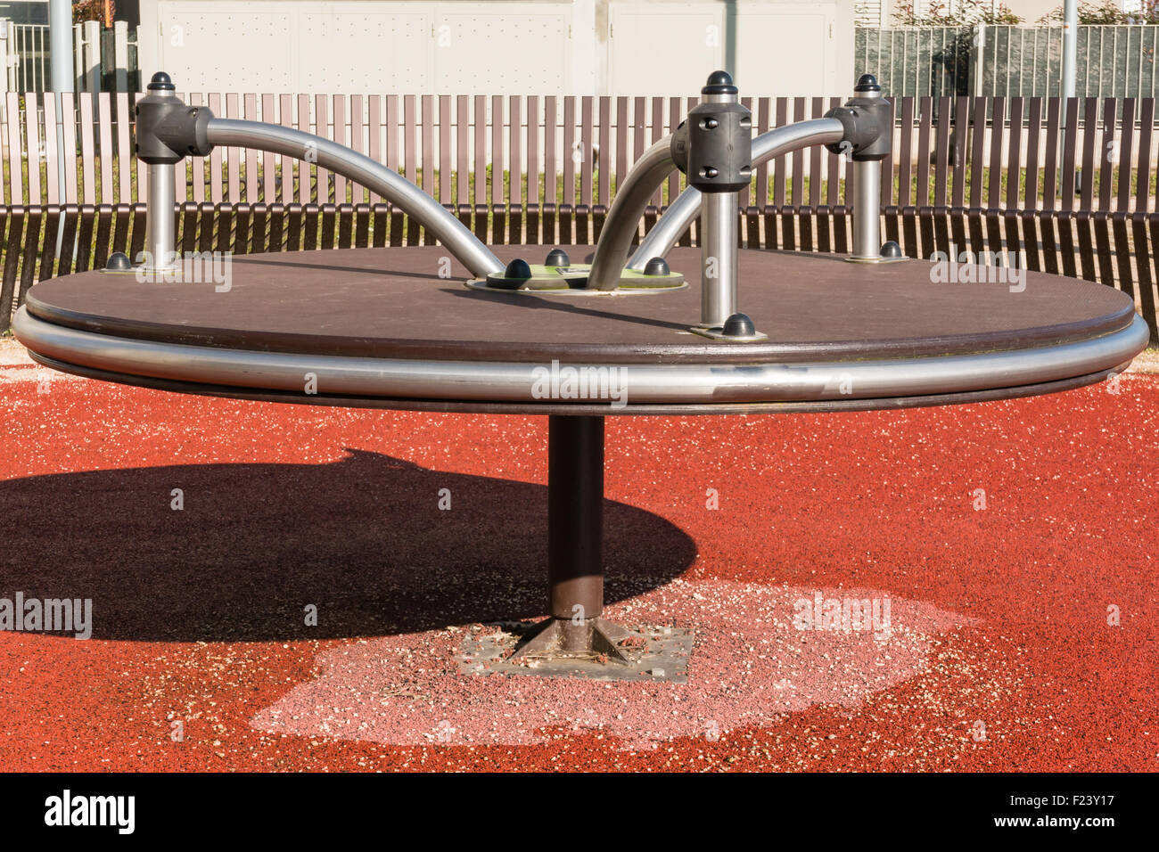 Modern metal merry-go-round playground in public park Stock Photo - Alamy