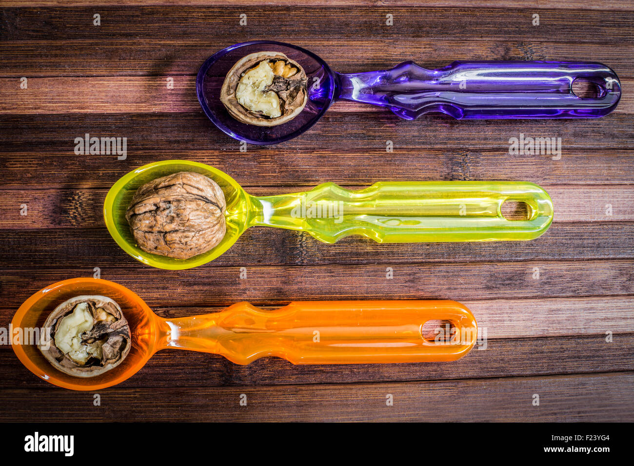 nuts in spoons Stock Photo - Alamy