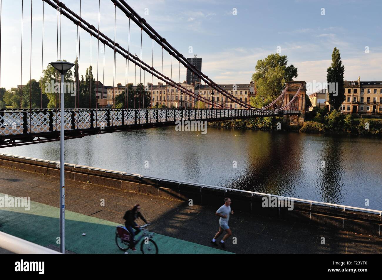 Glasgow suspension bridge jogger hi-res stock photography and images ...