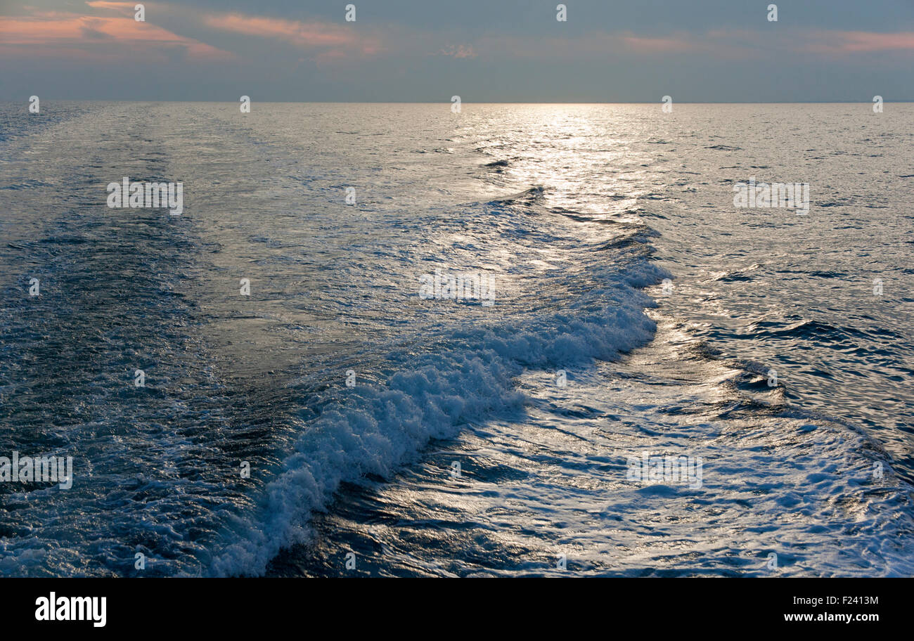 Wave on the sea at sunset Stock Photo - Alamy