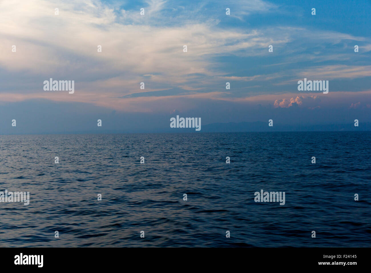 Wake on the sea at sunset Stock Photo - Alamy