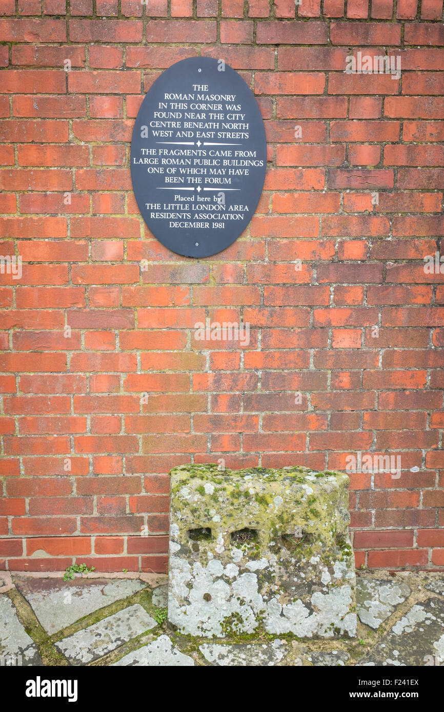 Wall plaque describing origins of the Roman masonry below, Chichester ...