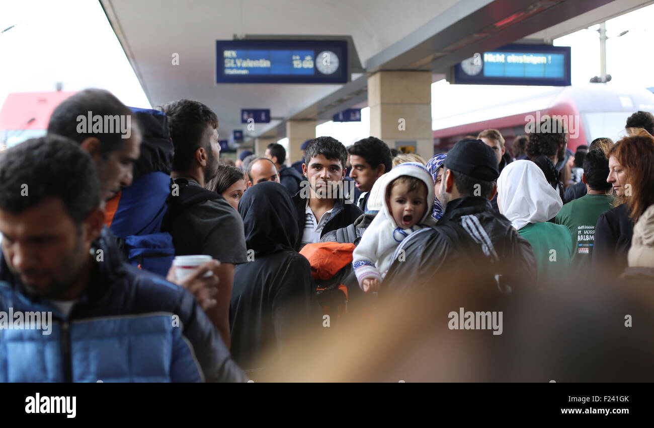 A single Syrian refugee stares out through the crowd with the look of ...