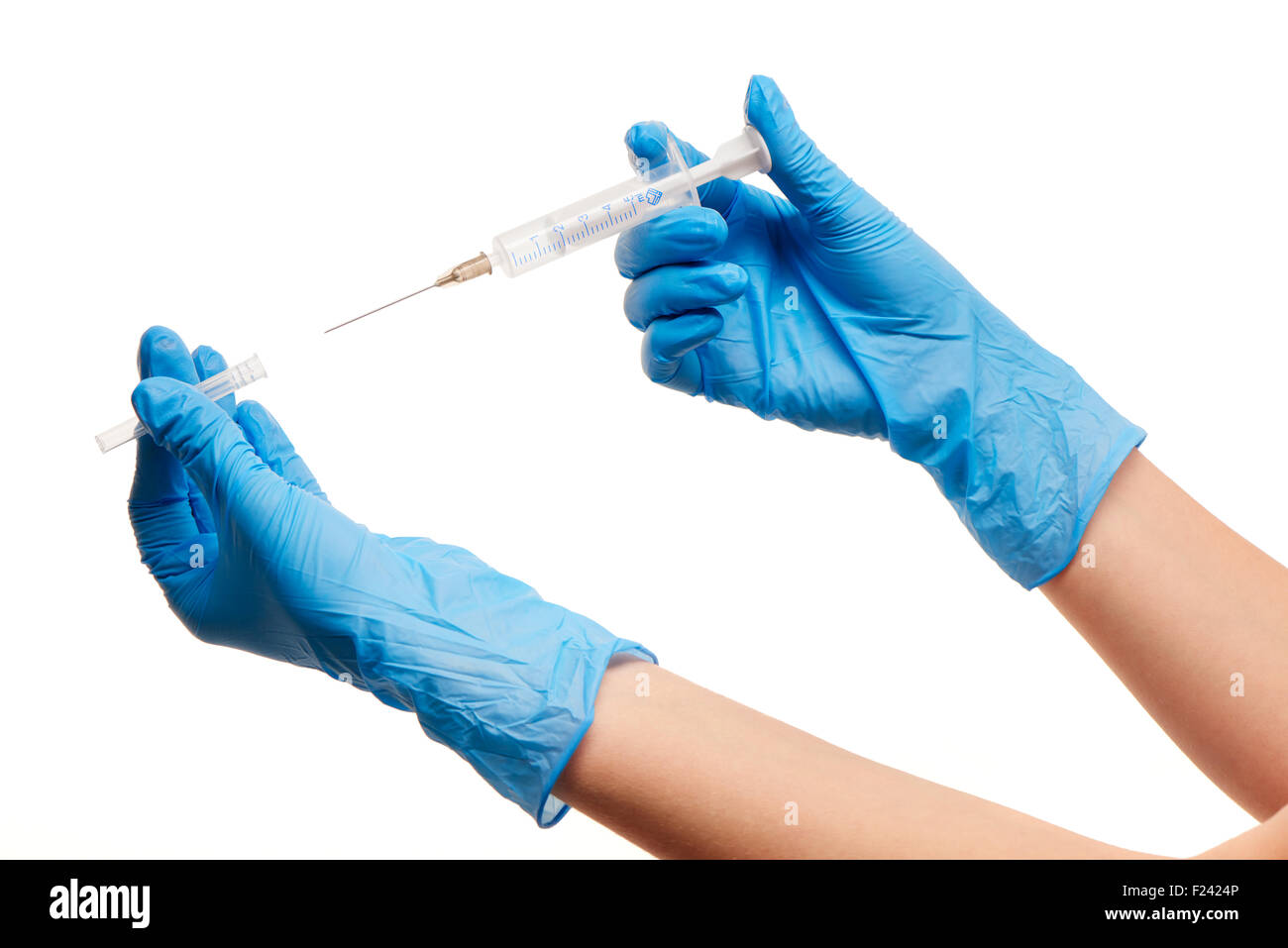 Close up of female doctor's hands in blue sterilized surgical gloves ...