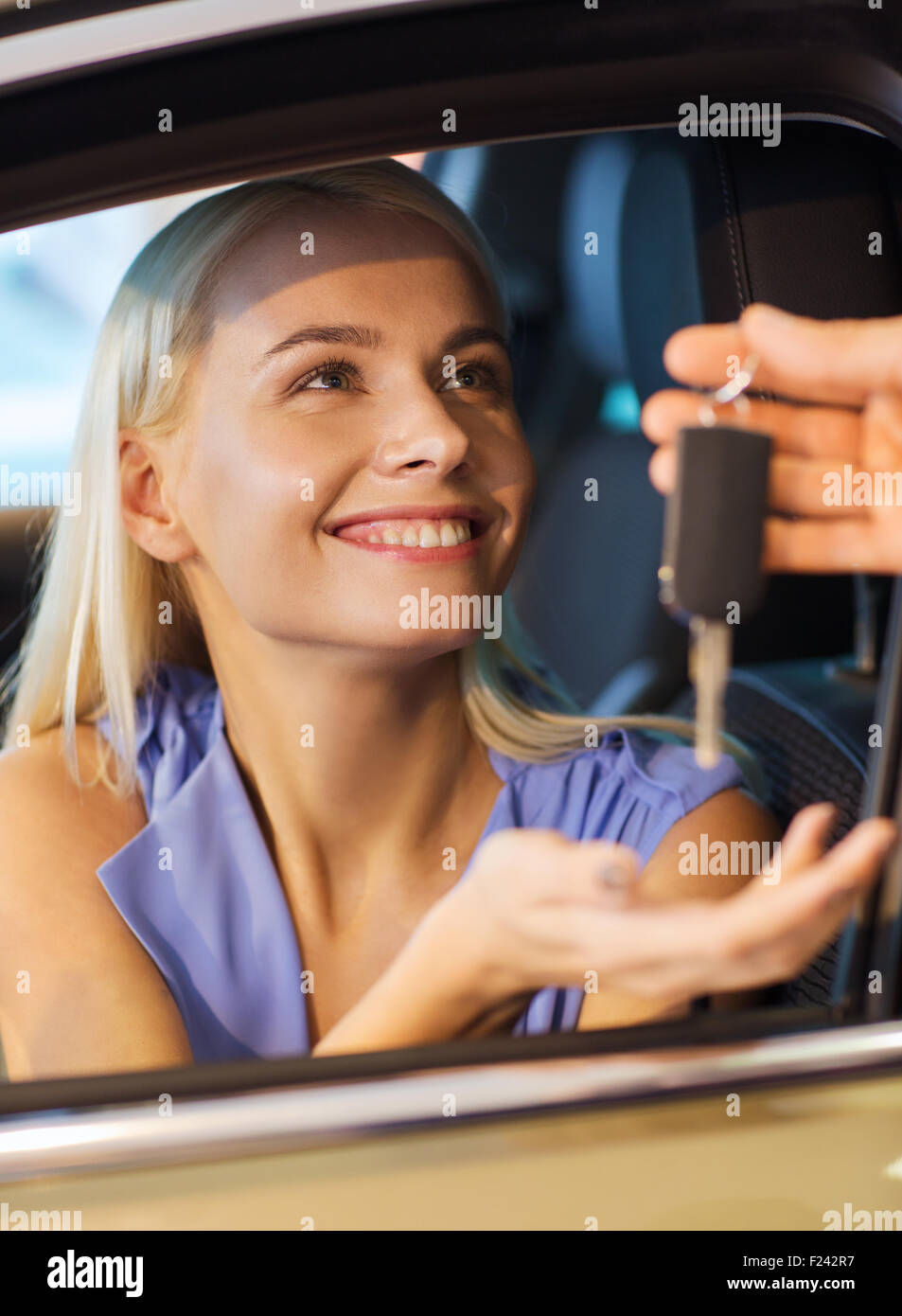 Happy girl with key in hand hi-res stock photography and images - Alamy