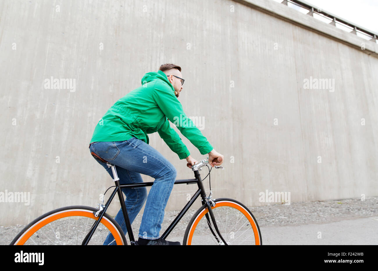 happy young hipster man riding fixed gear bike Stock Photo - Alamy