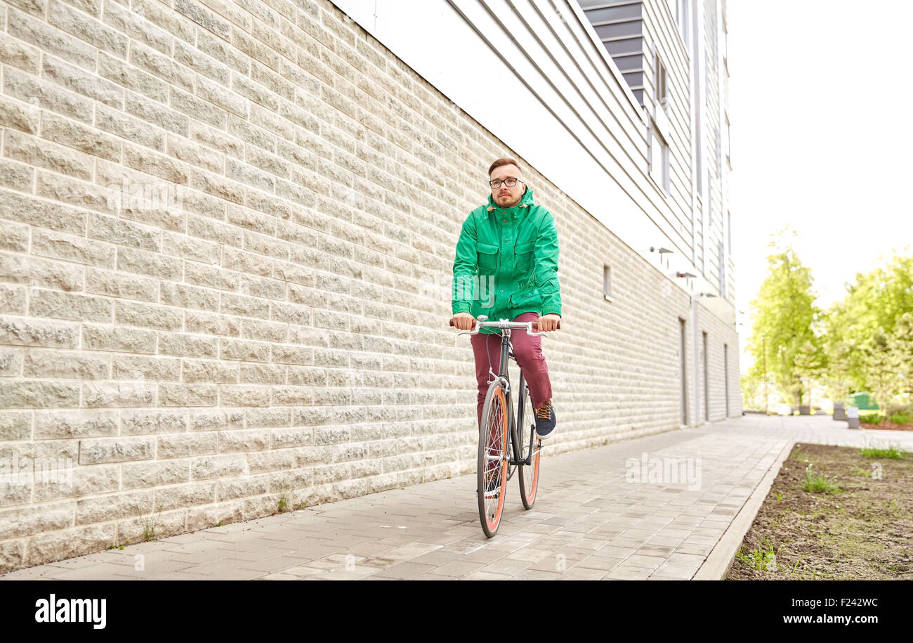 young hipster man riding fixed gear bike Stock Photo - Alamy