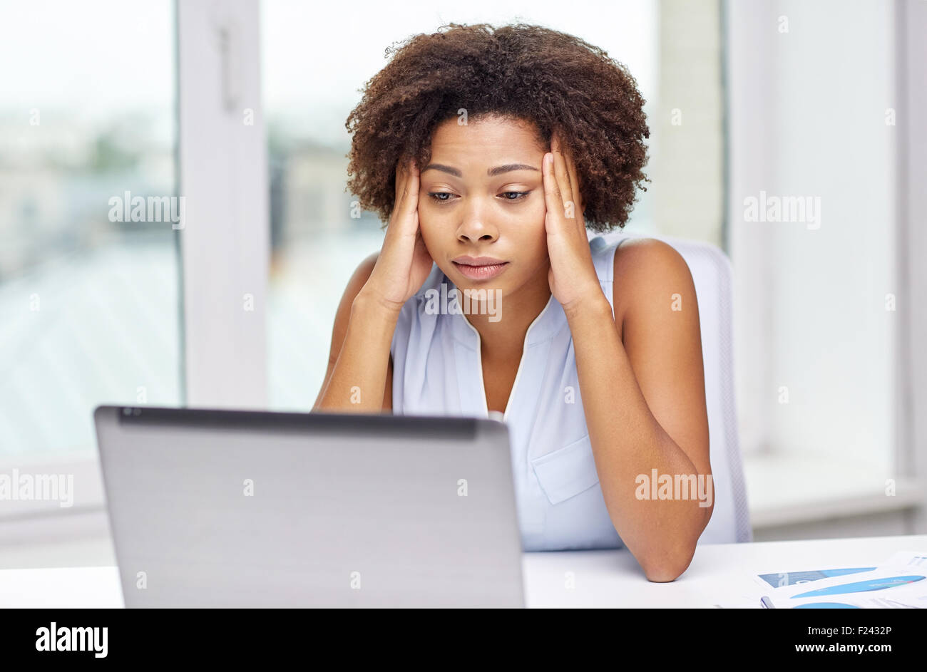 african woman with laptop at office Stock Photo - Alamy