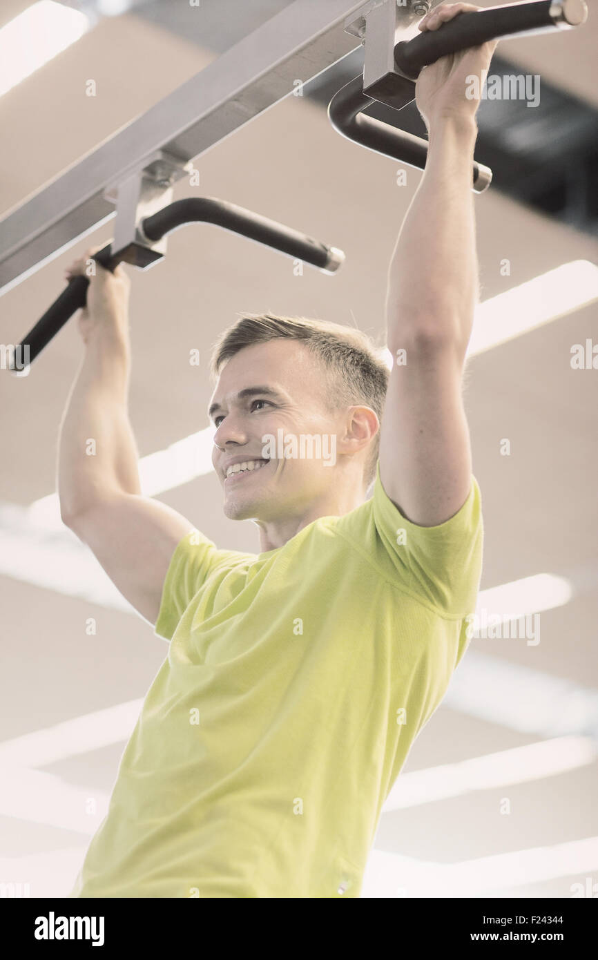 smiling man exercising in gym Stock Photo - Alamy