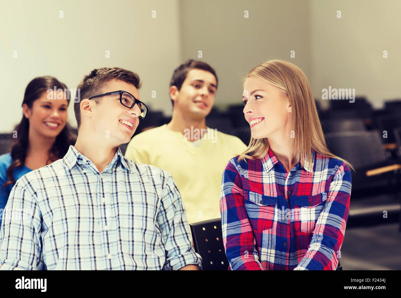 group of smiling students in lecture hall Stock Photo - Alamy