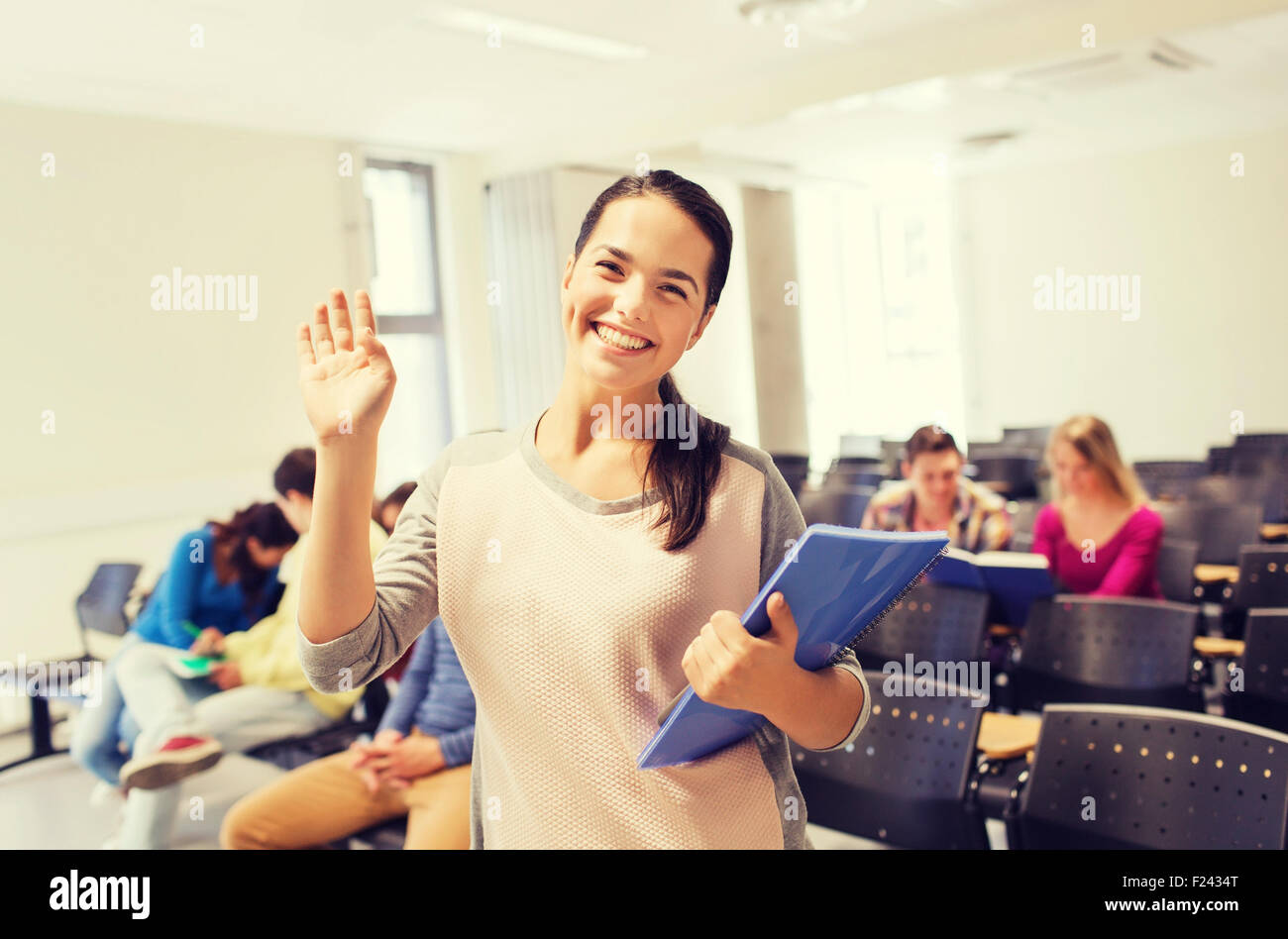 group of smiling students in lecture hall Stock Photo - Alamy