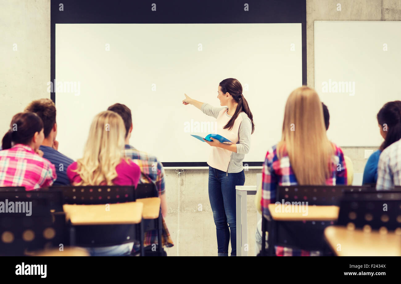 group of smiling students in classroom Stock Photo - Alamy