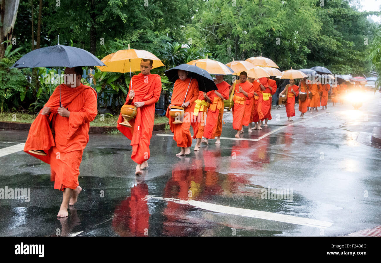 Buddhist monks collect alms free food charity Stock Photo - Alamy