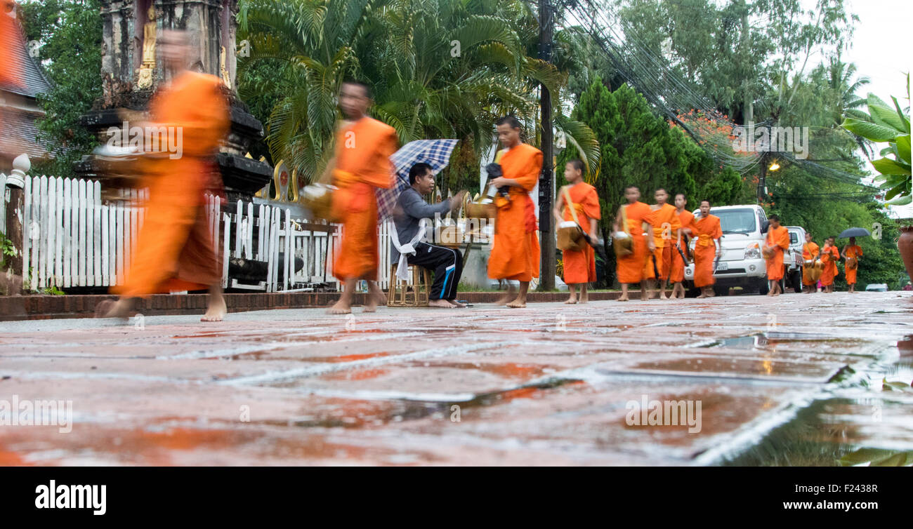 Buddhist monks collect alms free food charity Stock Photo - Alamy