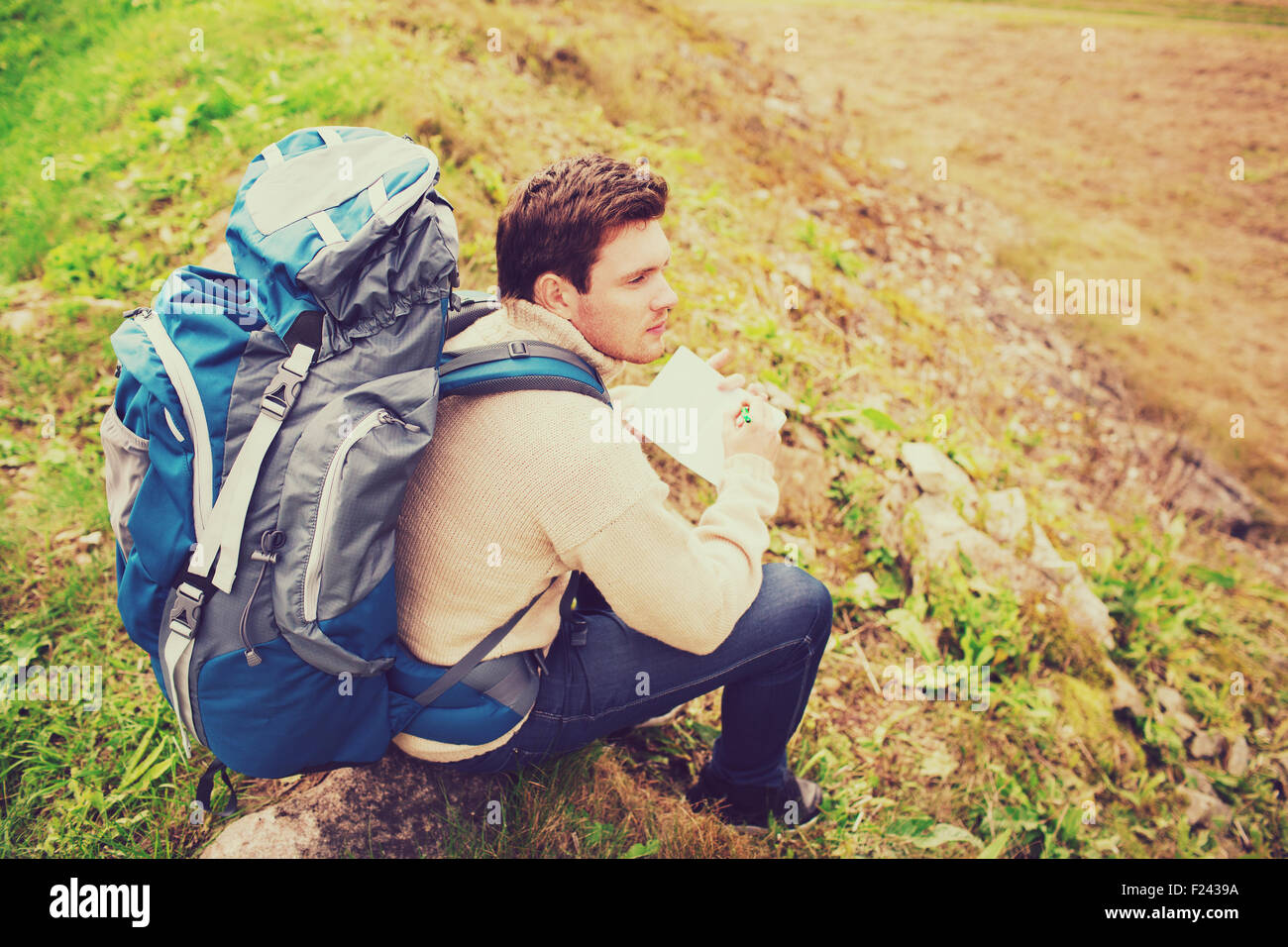 man with backpack hiking Stock Photo - Alamy