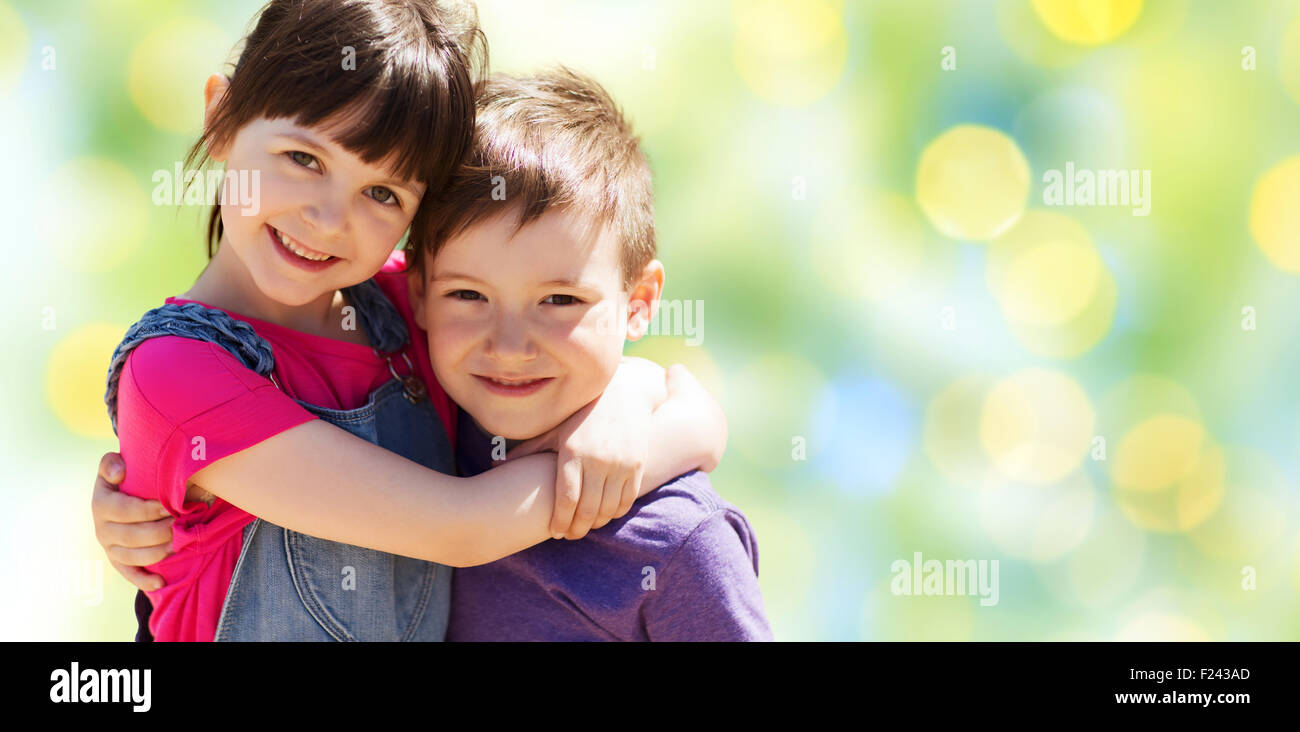 two happy kids hugging over green lights Stock Photo - Alamy