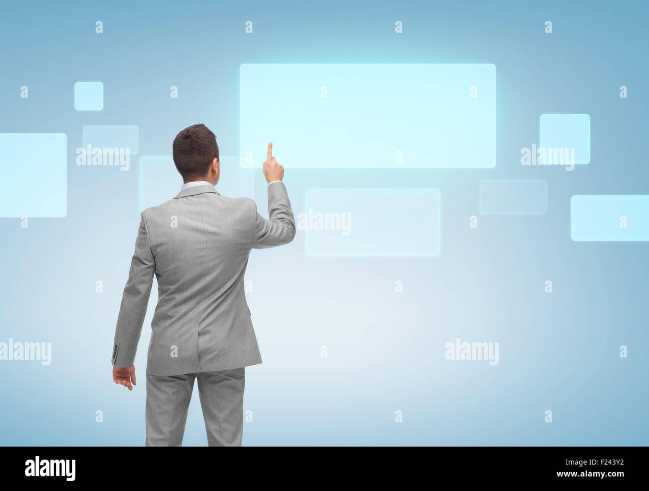 businessman pointing finger to virtual screen Stock Photo - Alamy
