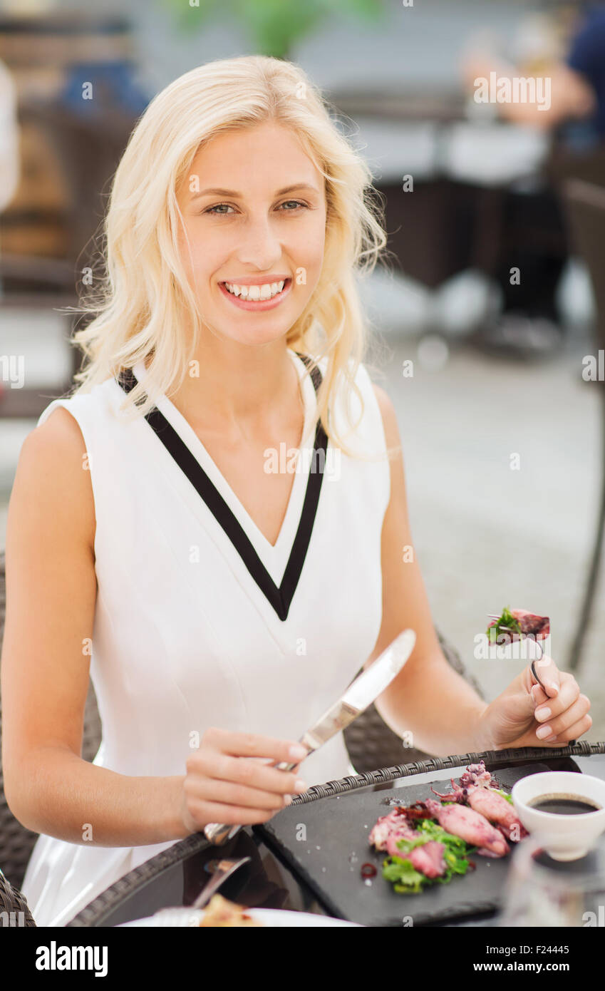 Woman eating restaurant hi-res stock photography and images - Alamy