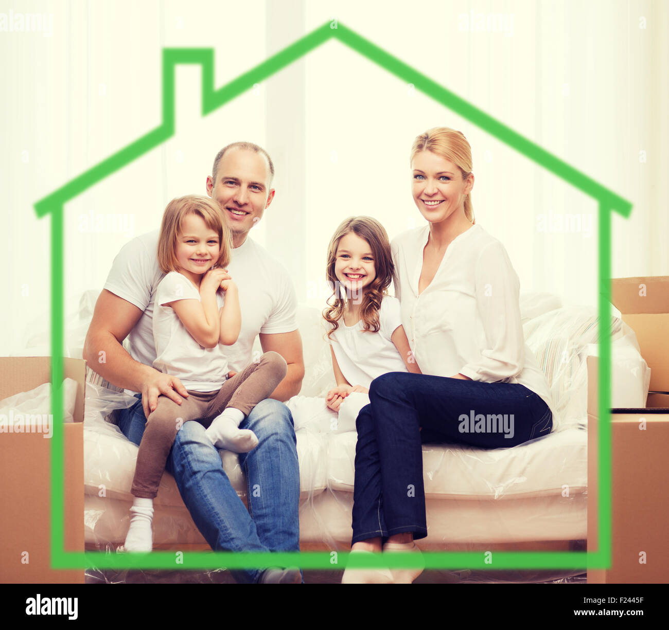 smiling parents and two little girls at new home Stock Photo - Alamy