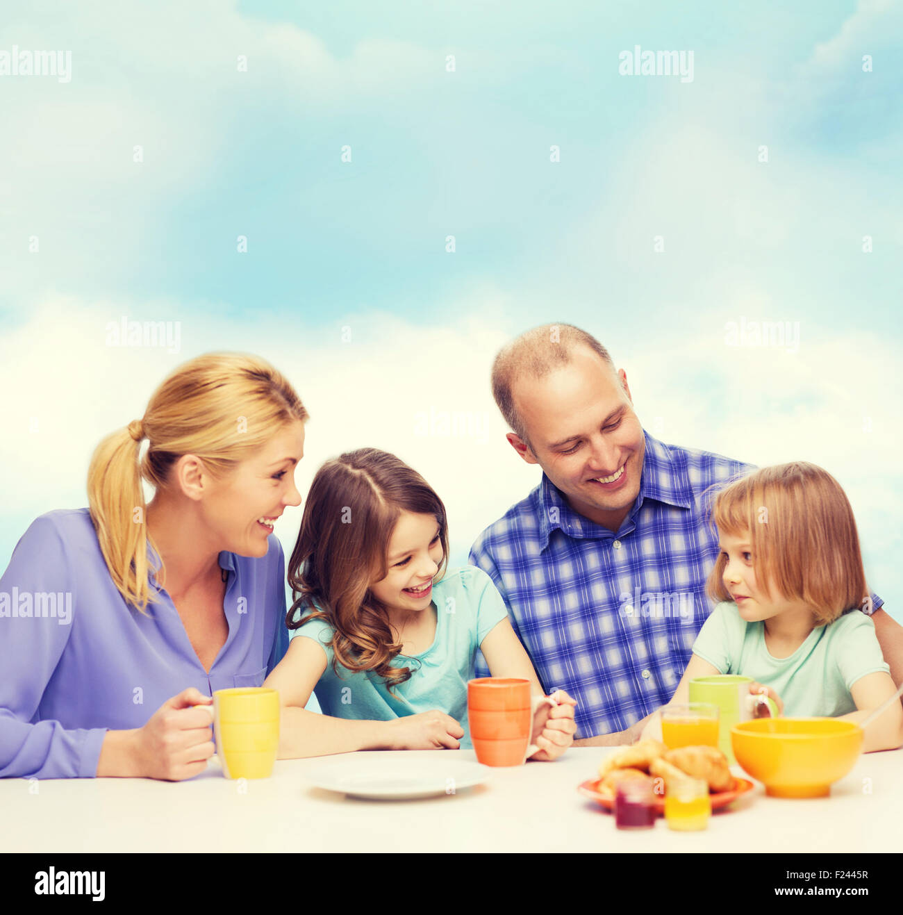 happy family with two kids with having breakfast Stock Photo - Alamy