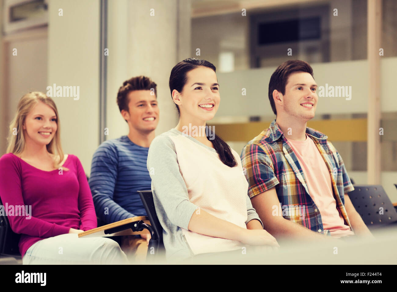 group of smiling students in lecture hall Stock Photo - Alamy