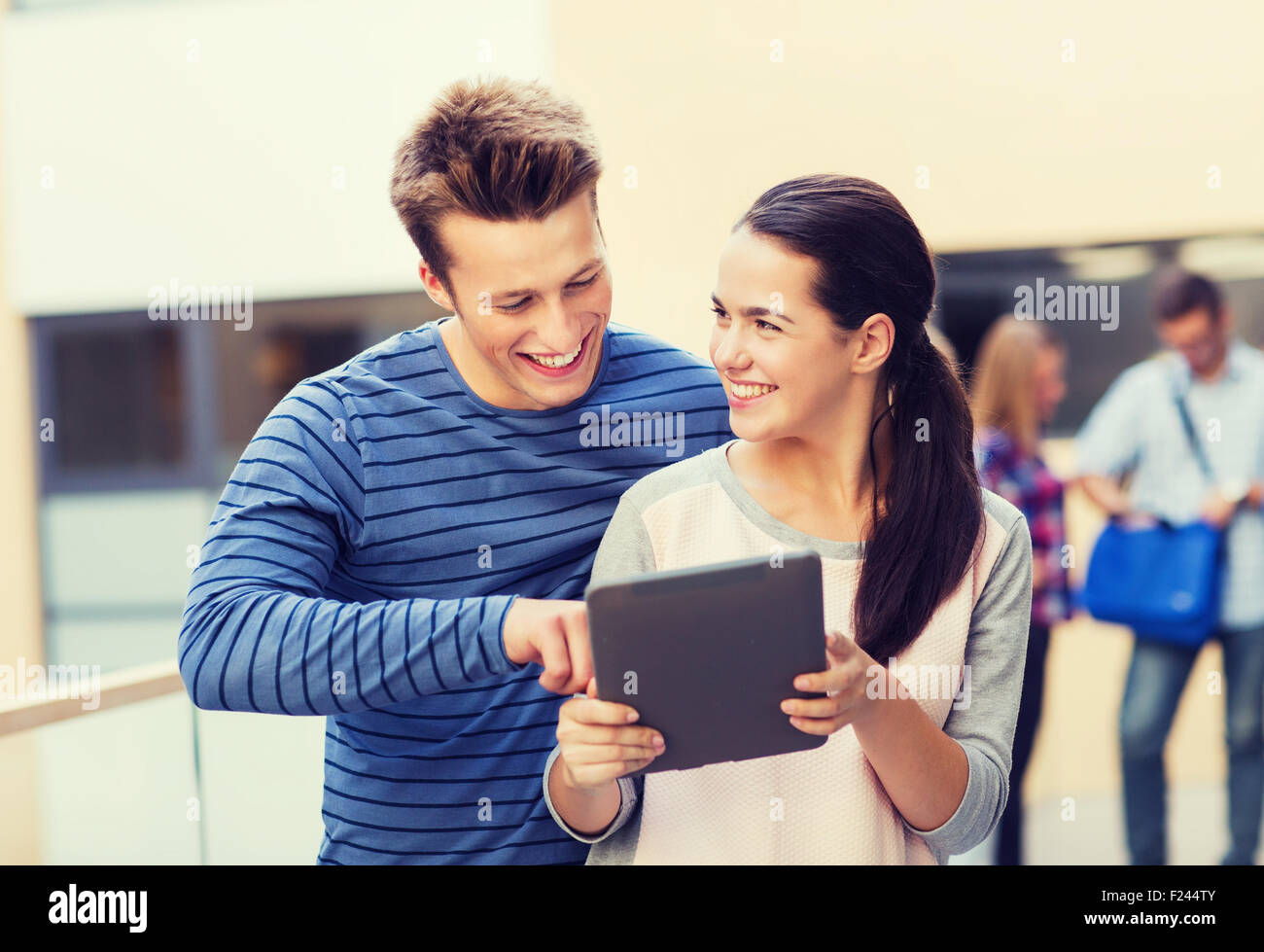 group of smiling students tablet pc computer Stock Photo - Alamy