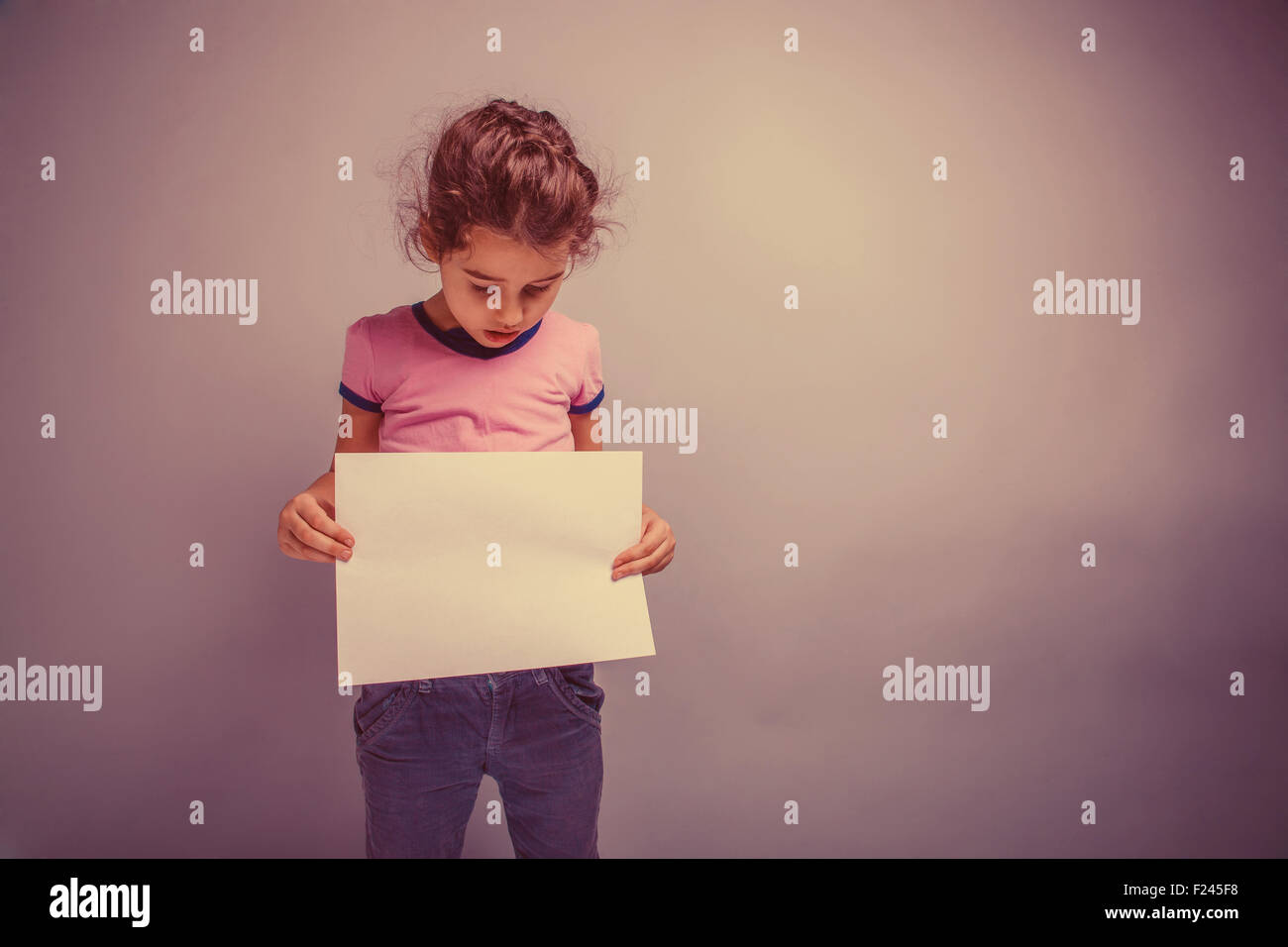 girl child 6 years of European appearance holds a blank slate, l Stock ...