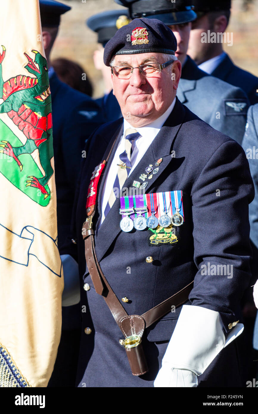 Senior male, ex-serviceman in uniform and beret, with a row of medals ...