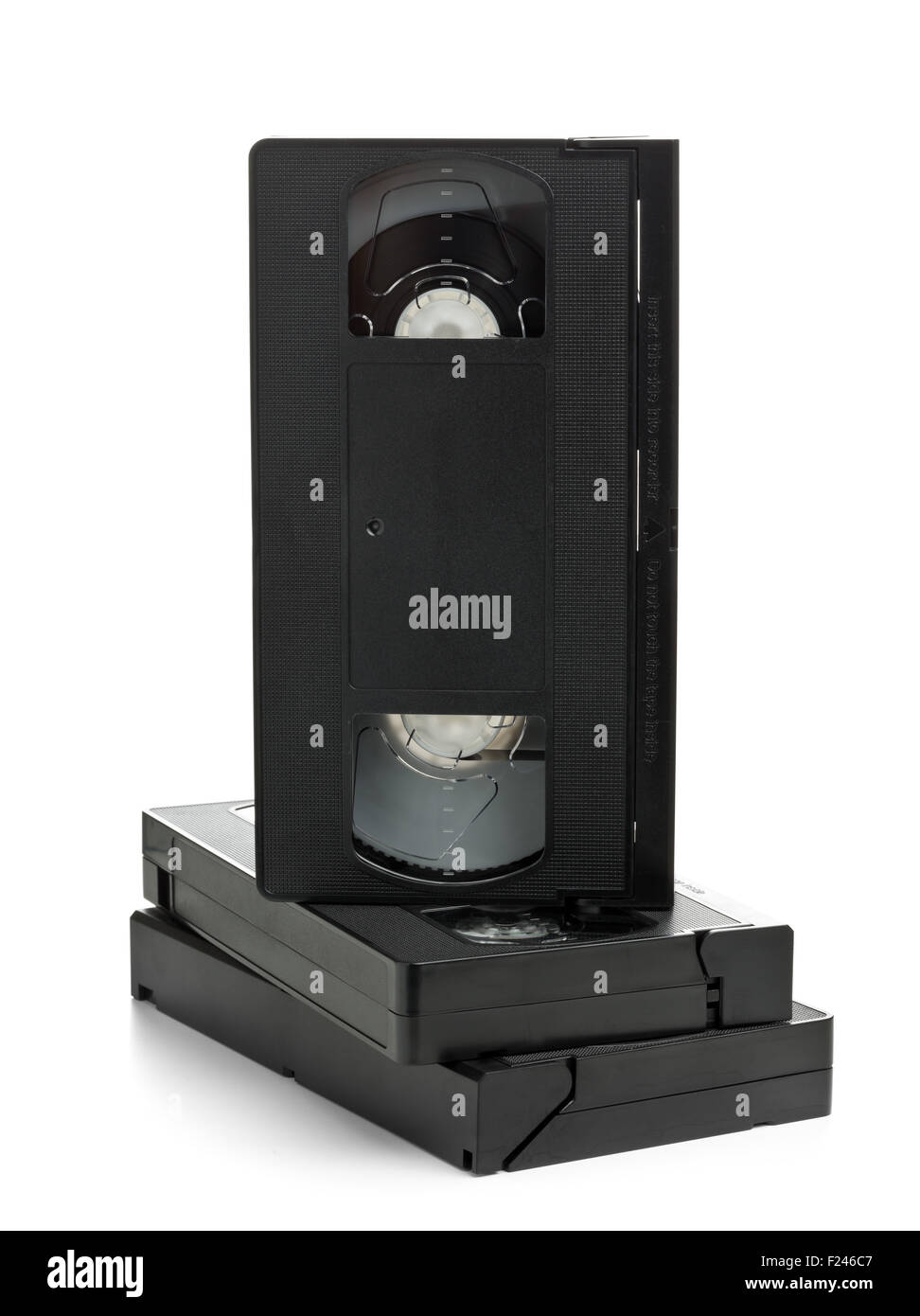 Stack of analog video home system (VHS) tape over white background ...