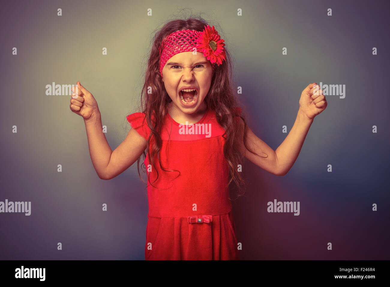 teen girl of European appearance five years angry opened her mou Stock ...