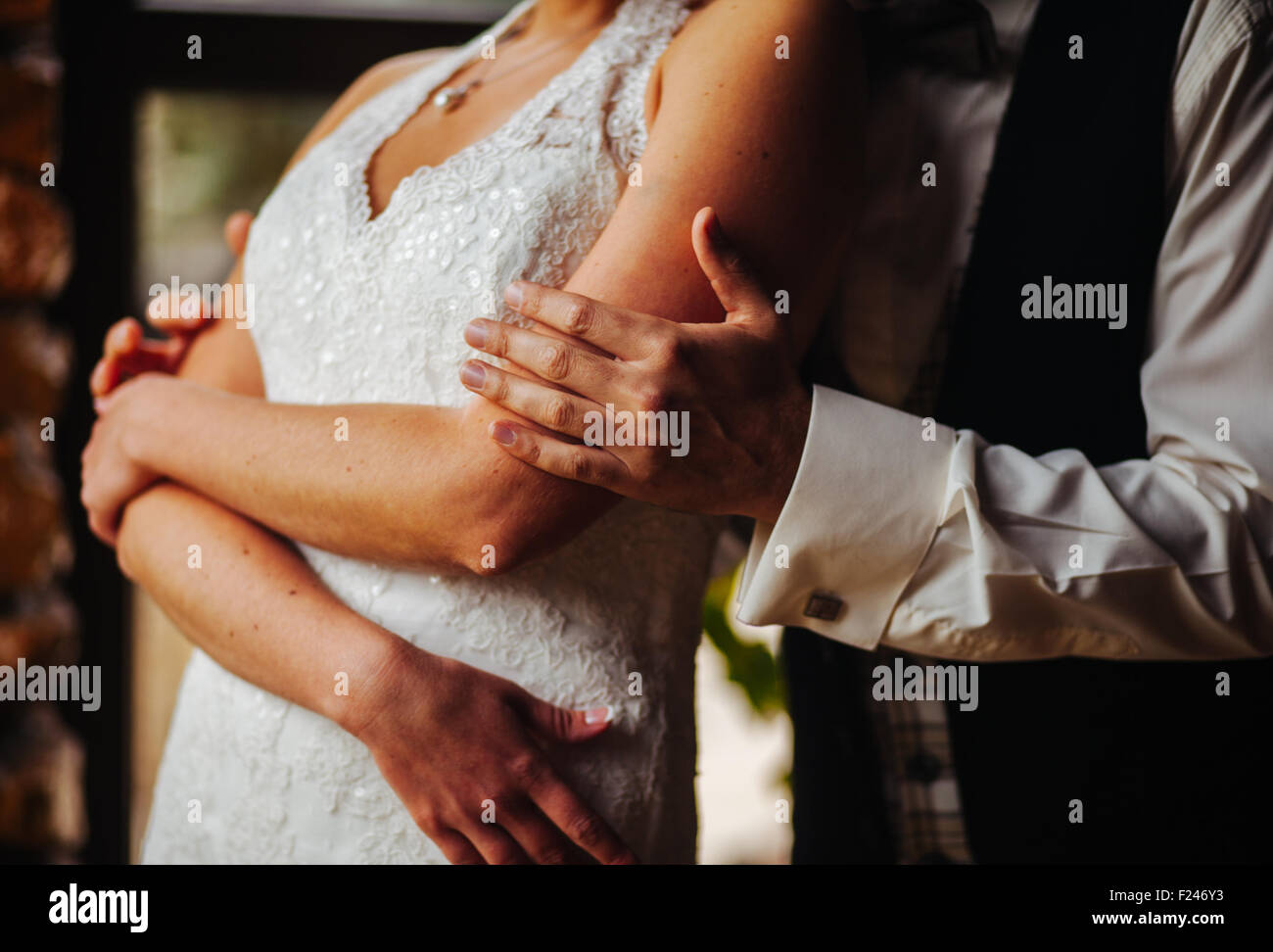 groom gently embraces the bride Stock Photo - Alamy