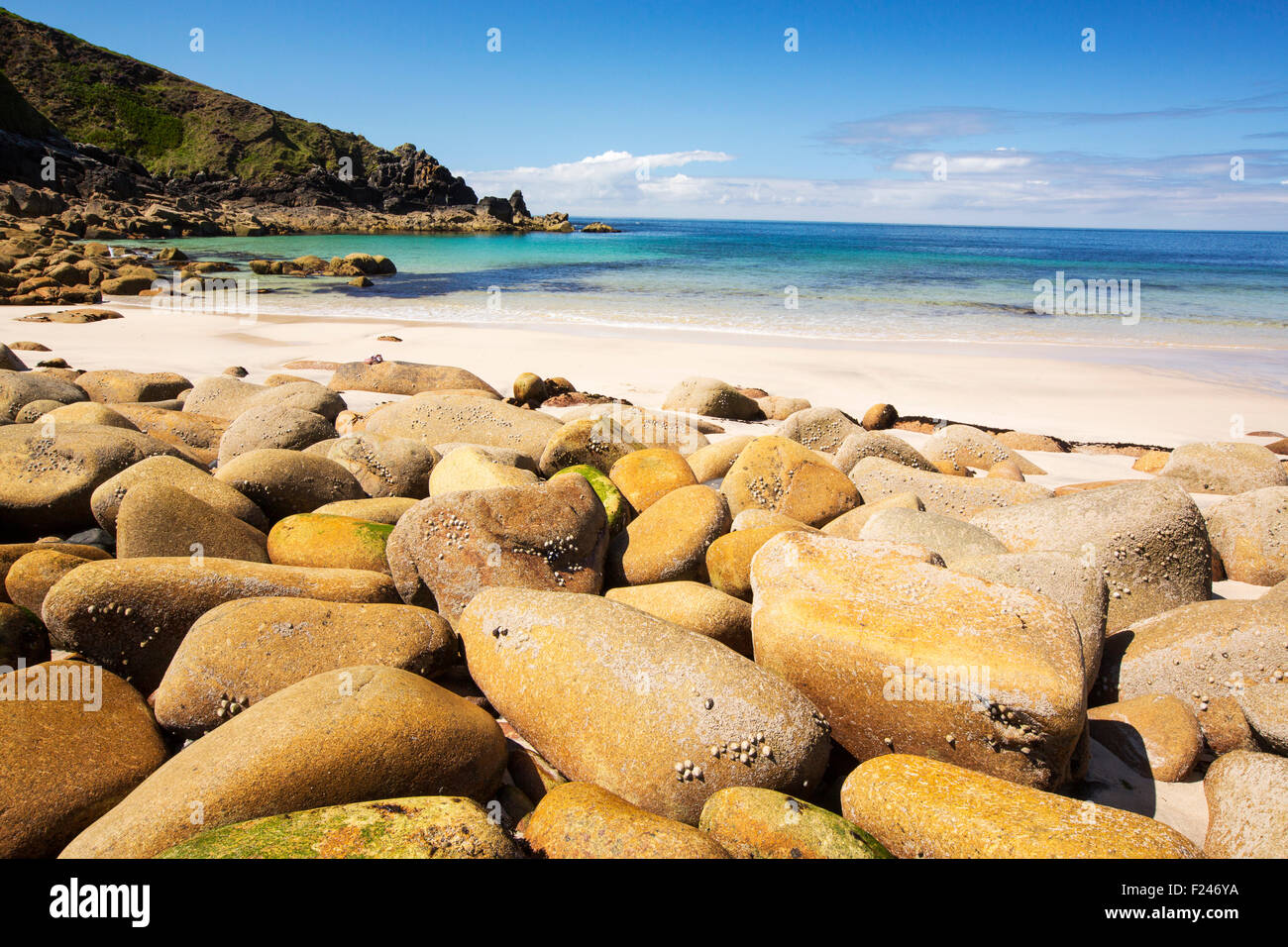 Weathered granite boulders on the beach at Porthmeor Cove, on Cornwall ...