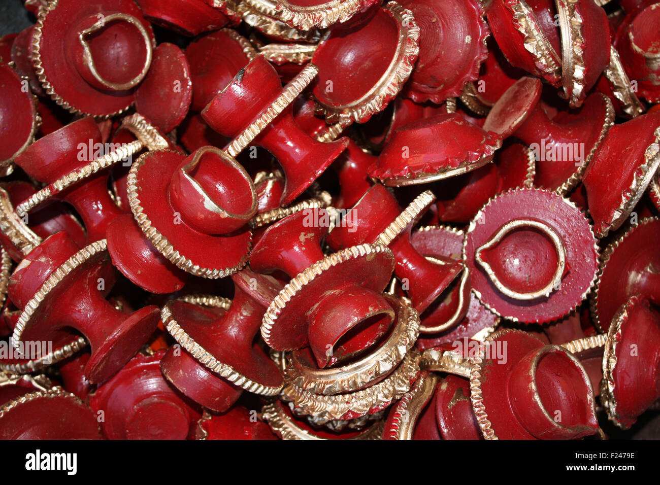 A background of red clay lamps with traditional design for Diwali ...