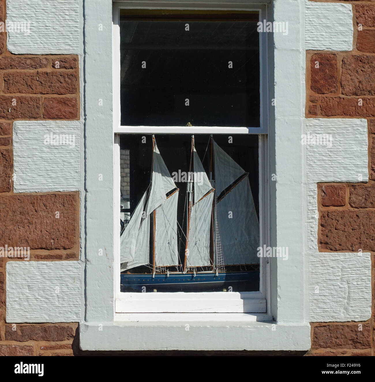 Model sailing ship in window of traditional house Stock Photo - Alamy