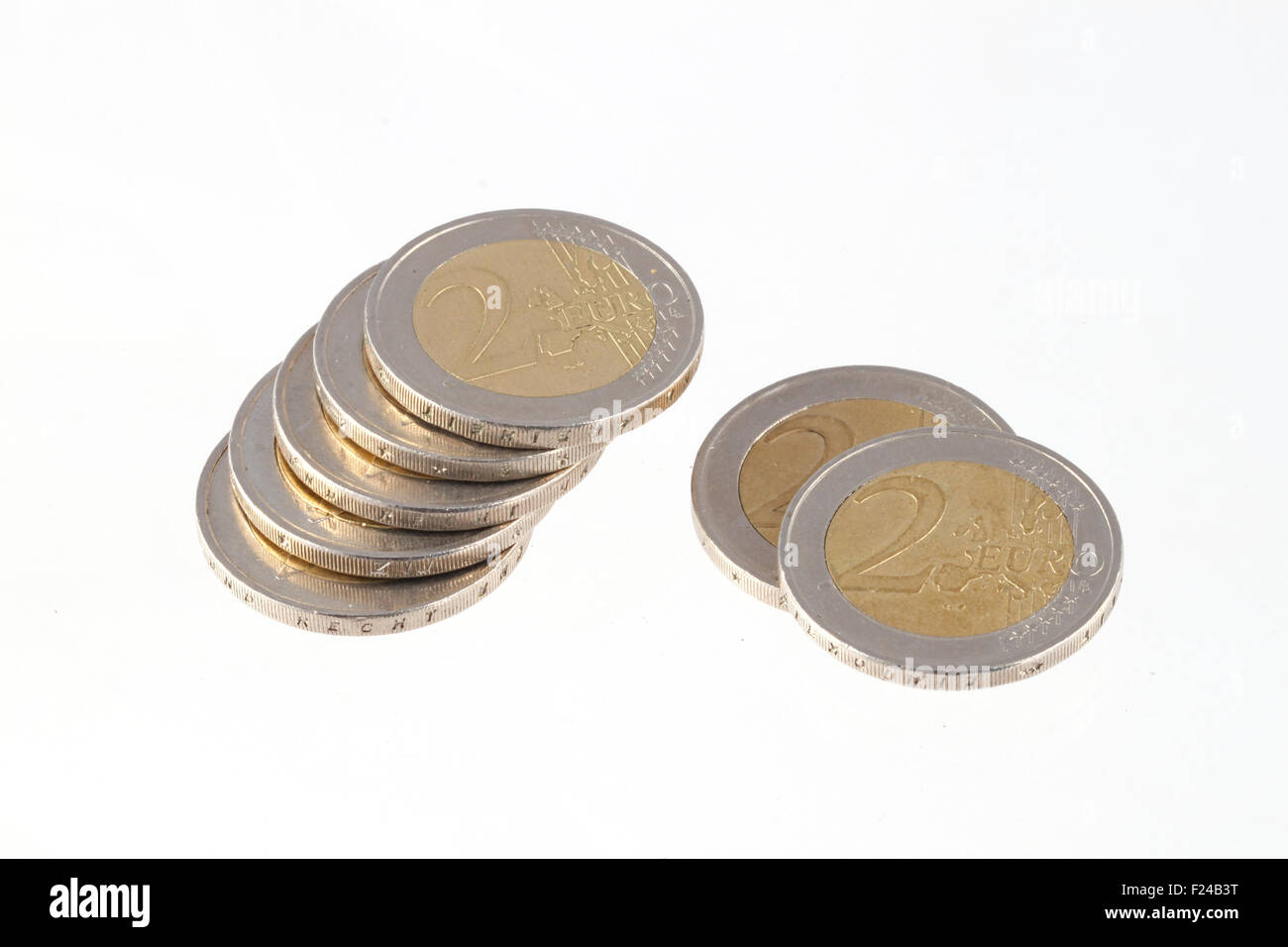 Close up photo of two Euro coins on a plain white background Stock ...