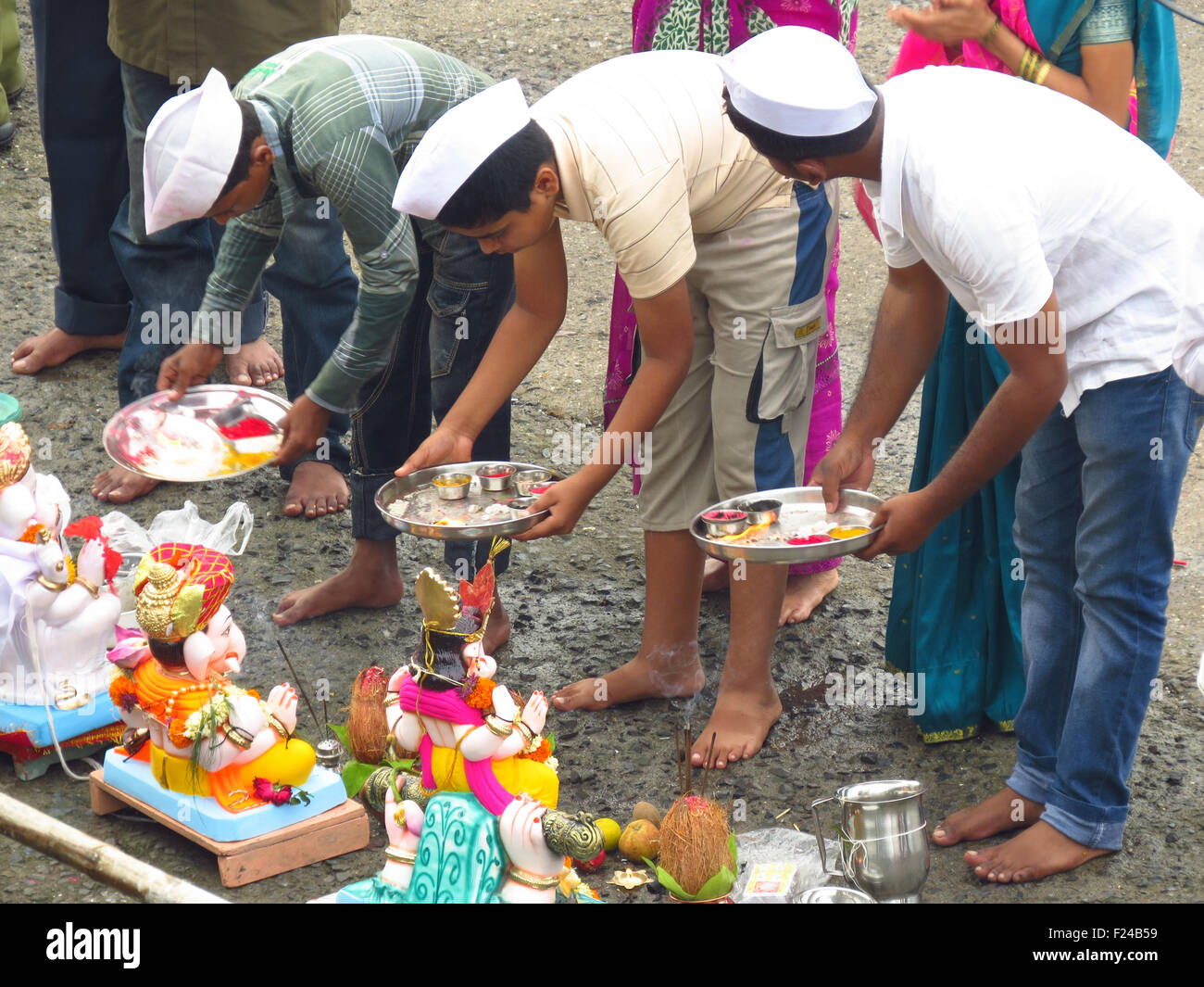 Indian people traditionally perform a ritual to end the 10-day long ...