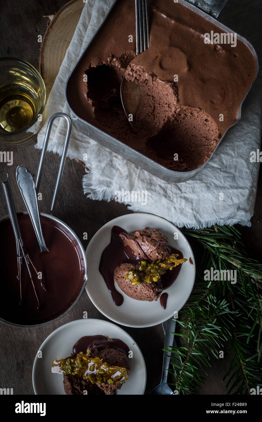 Single malt & chocolate mousse in vintage tin pot on dark wooden ground ...